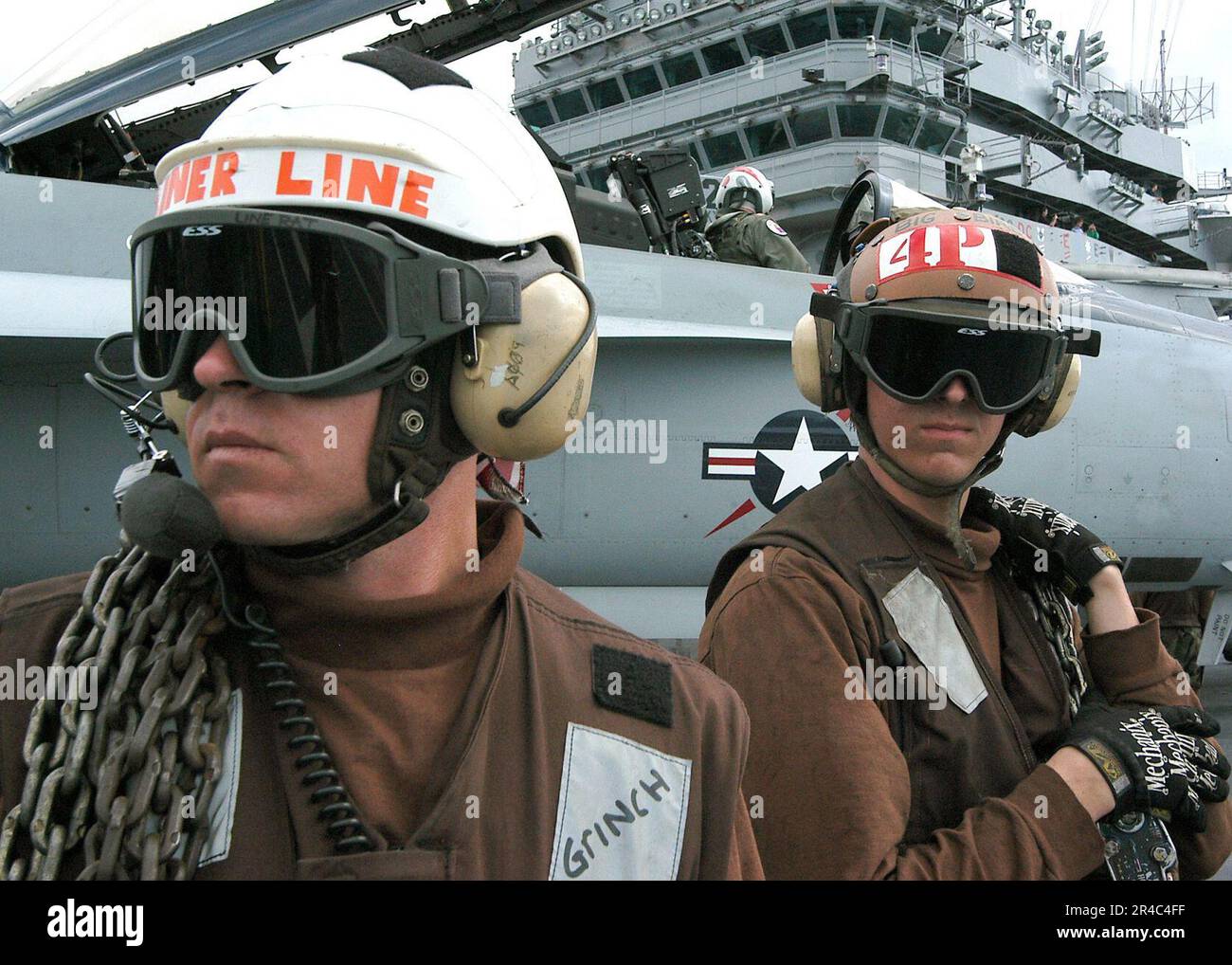 US Navy Aviation Structural Mechanic 1st Class and Airman observe ...