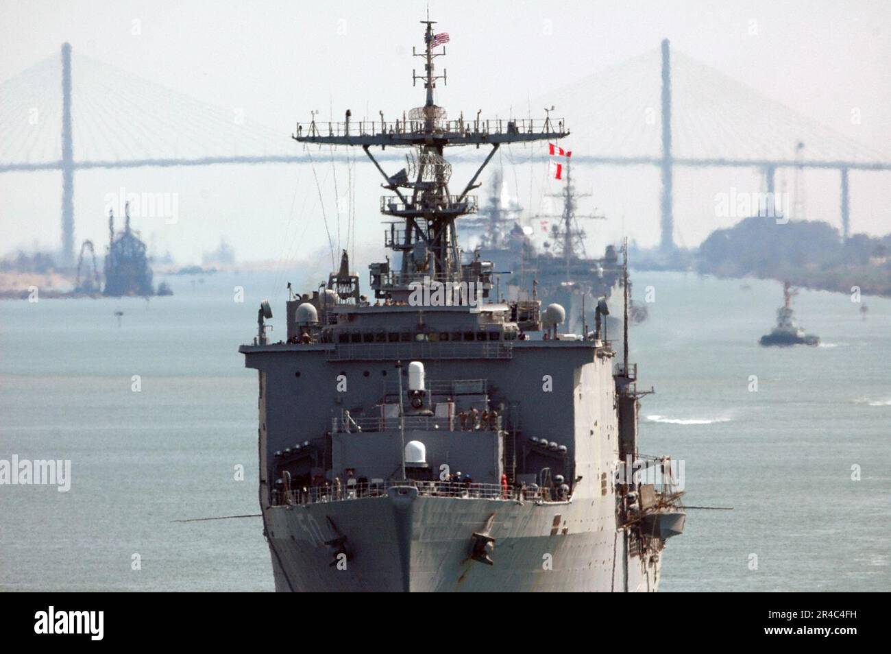US Navy The dock landing ship USS Carter Hall (LSD 50) trails the ...