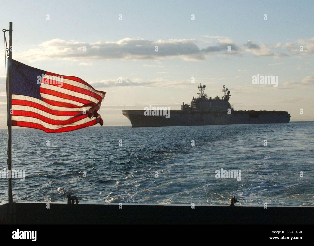US Navy The American flag flies high as the Utility Landing Craft (LCU ...