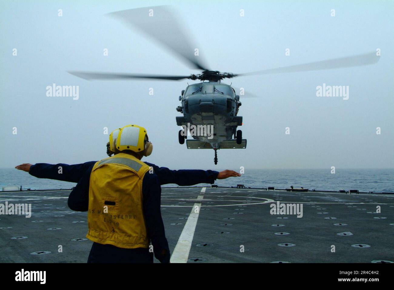 US Navy Landing Signal Enlisted (LSE) Boatswain's Mate Seaman launches ...