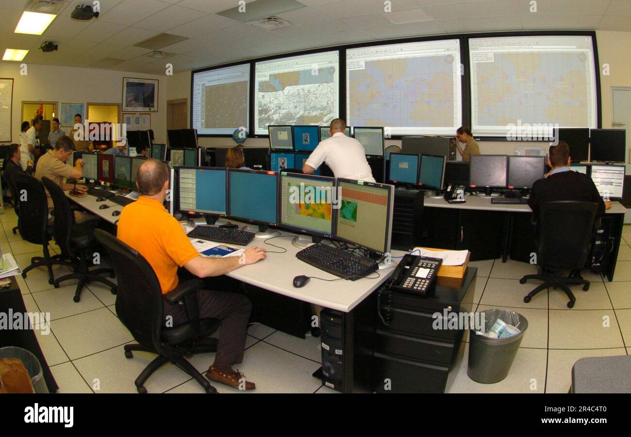 US Navy Aerographers at the Norfolk Naval Meteorological Center monitor ...