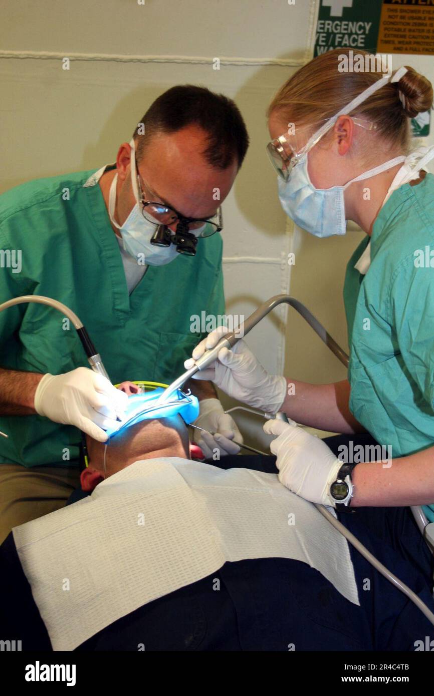 US Navy Health Services Officer Lt. Cmdr. and Hospital Corpsman 3rd ...