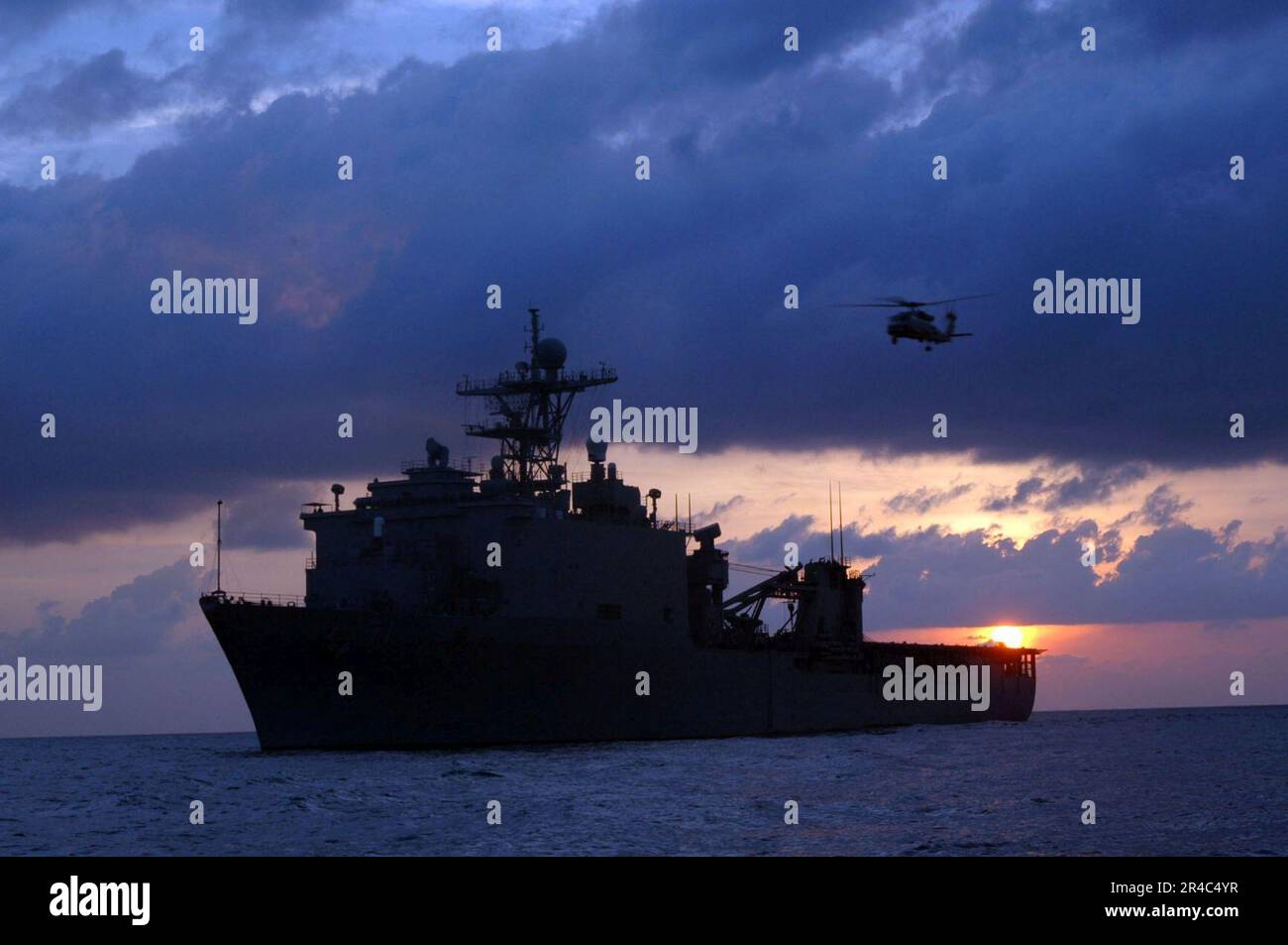 US Navy An SH-60B conducts an early morning fly-by of the amphibious ...
