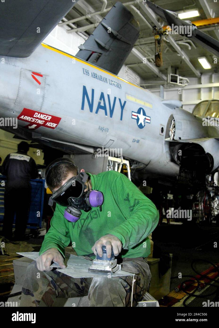 US Navy Aviation Structural Mechanic 2nd Class performs routine ...