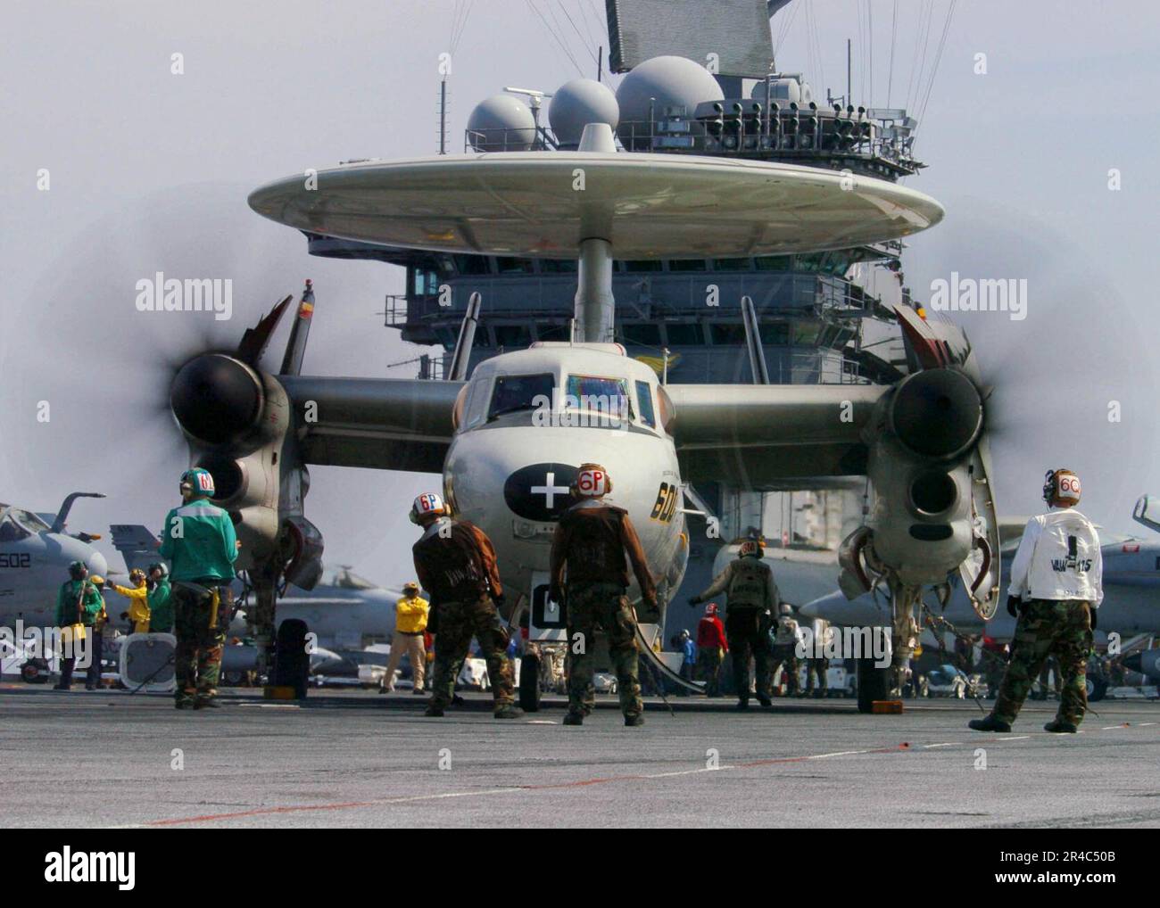 US Navy Sailors prepare an E-2C Hawkeye assigned to the Tigertails of ...