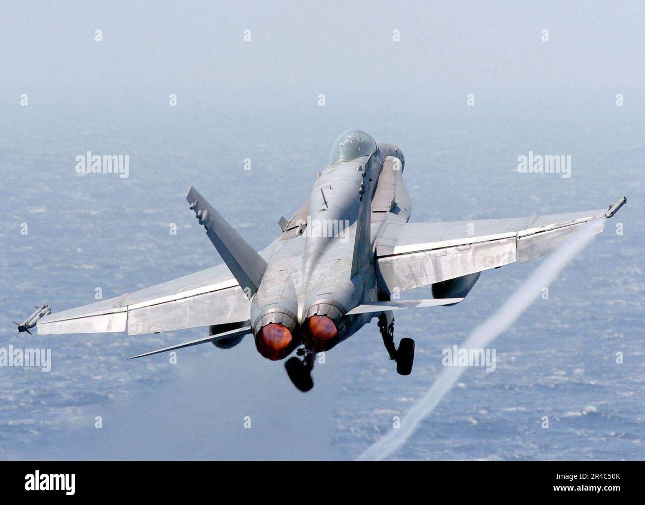 US Navy An F-A-18 Hornet assigned to the Rampagers of Strike Fighter ...