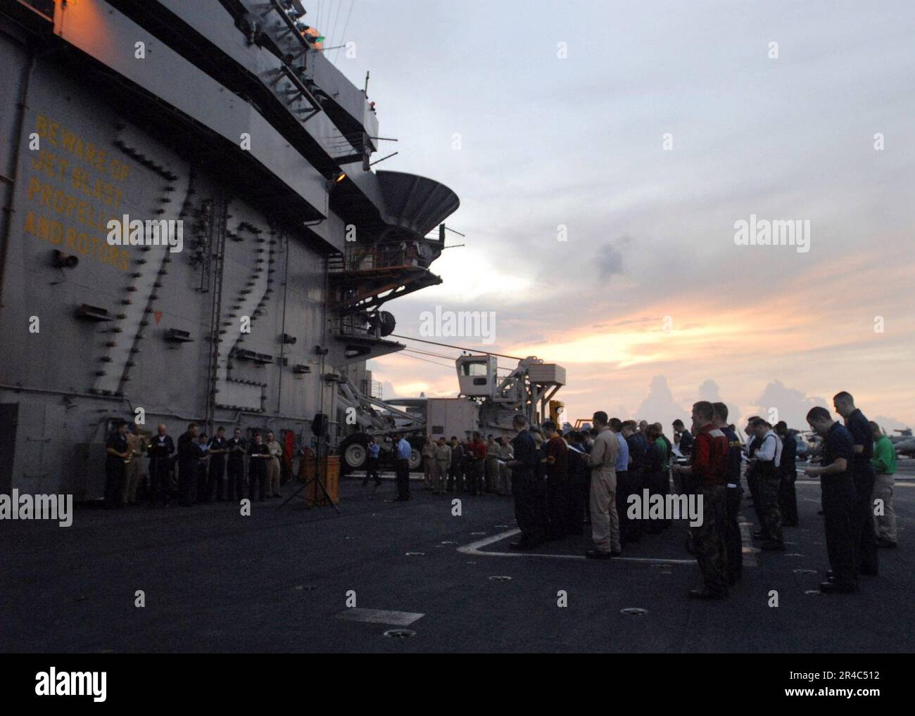US Navy Sailors participate in a Easter sunrise service held on the ...