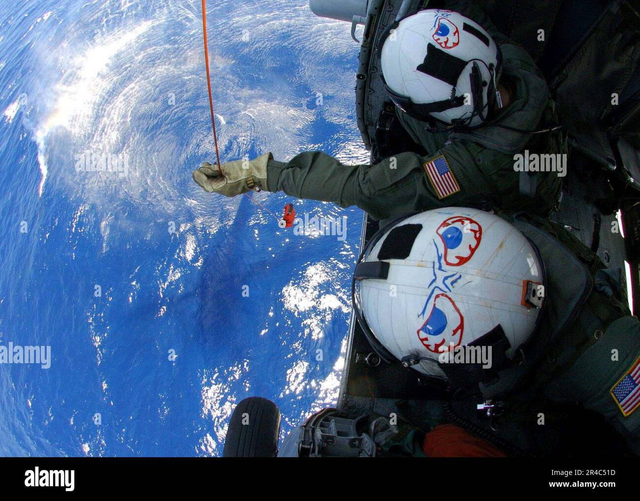 US Navy Aviation warfare systems operators simulate a survivor rescue ...