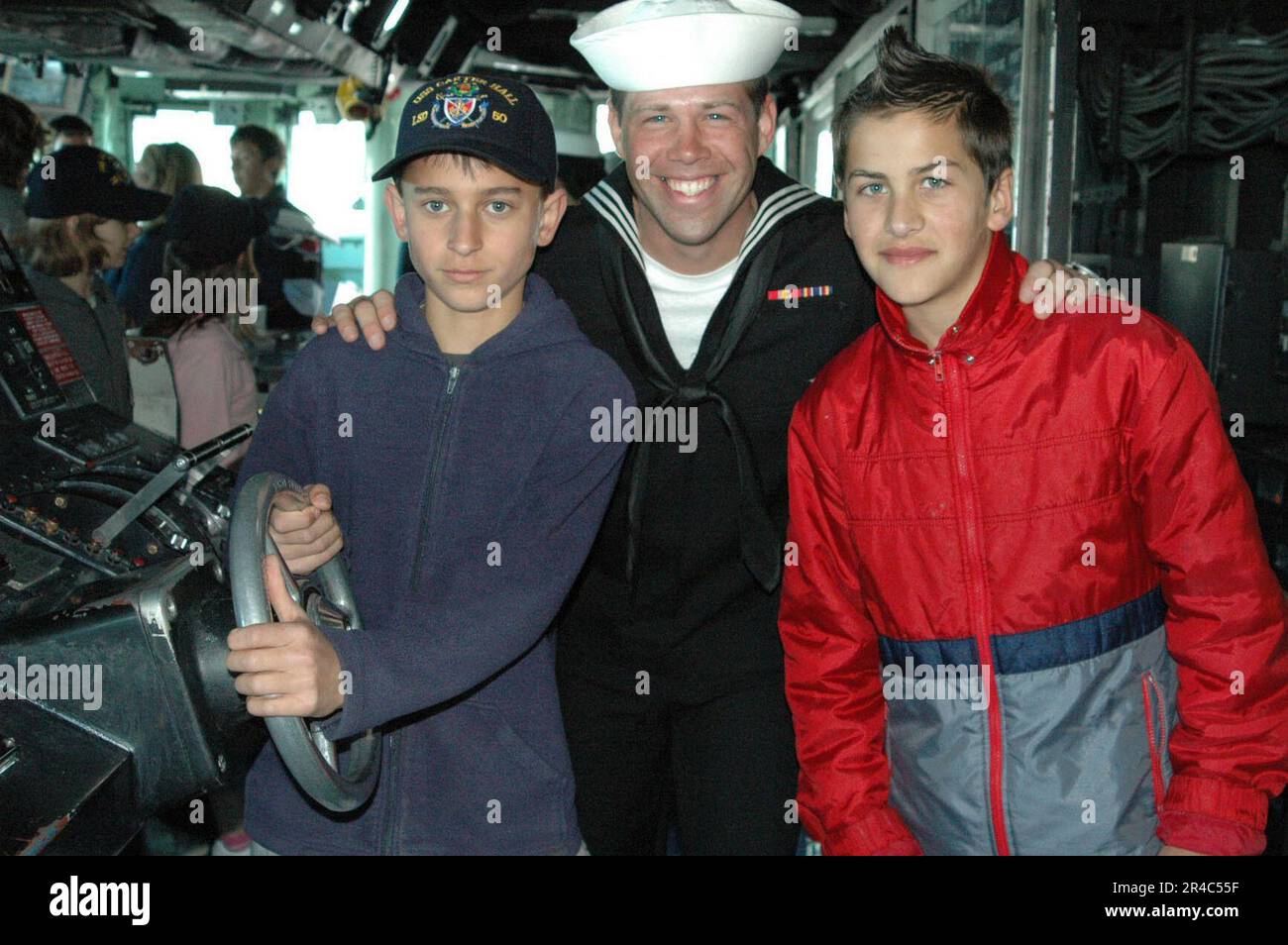 US Navy Seaman stationed aboard the amphibious dock landing ship USS ...