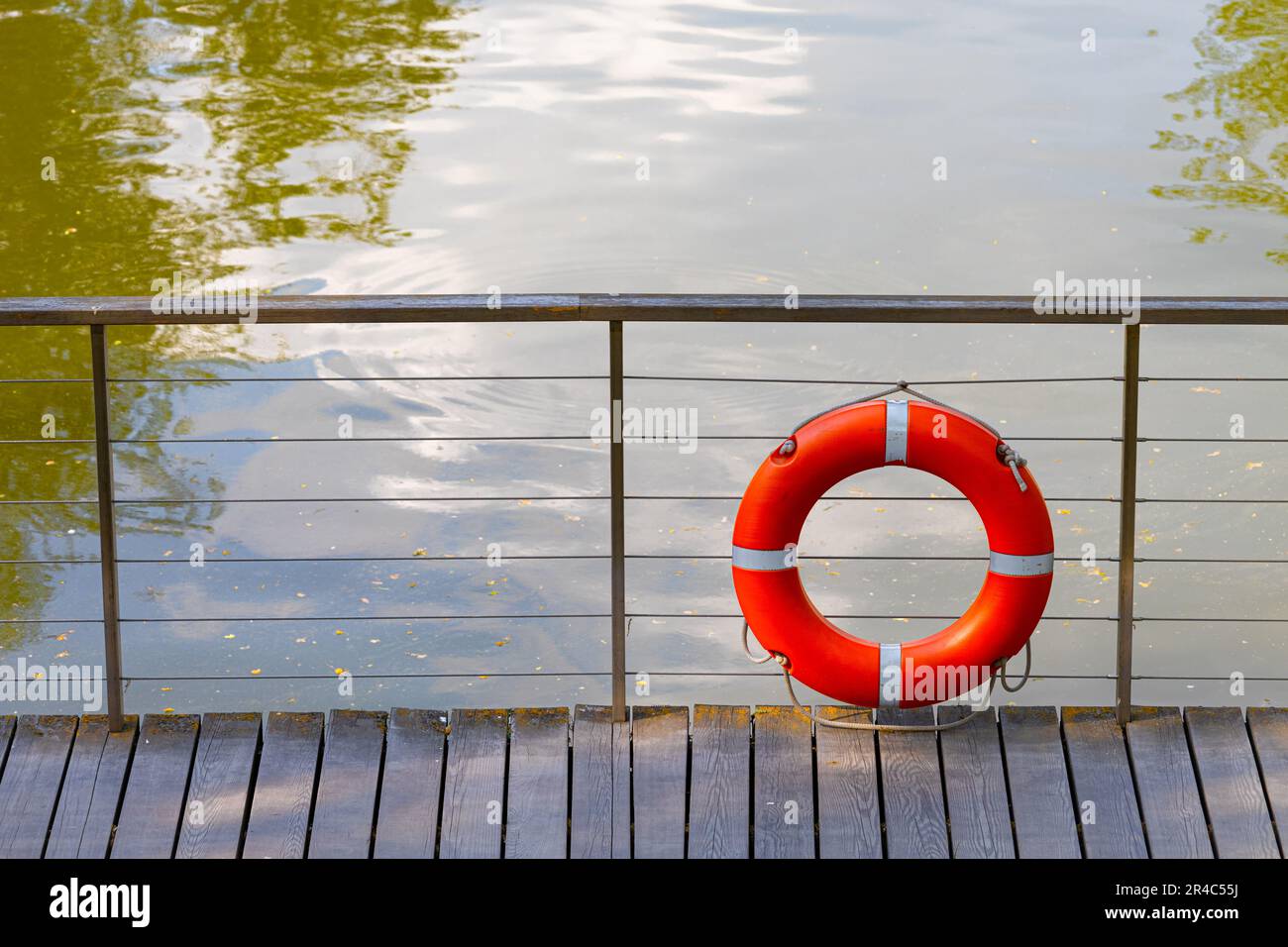 red lifebuoy on the pier without people. marine lifeline. drowning man ...