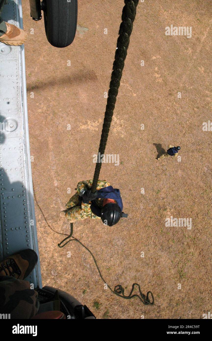 US Navy A Royal Australian Navy explosive ordnance disposal technician ...