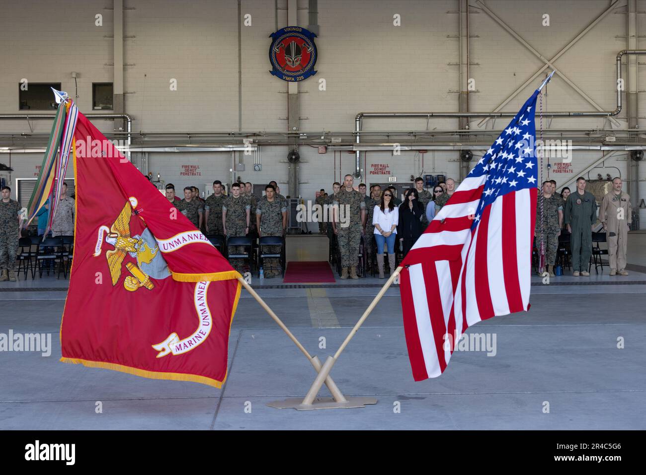 U.S. Marines and Sailors stand at attention during a retirement ...