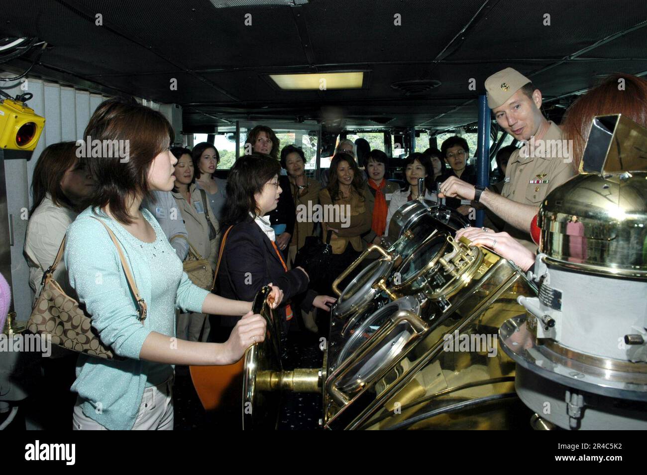 US Navy Cmdr. Navigator of USS Kitty Hawk (CV 63), explains the ...