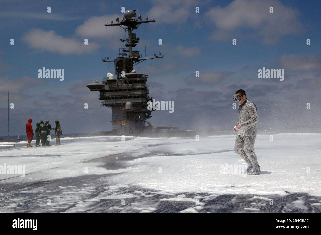 US Navy Damage Controlman 3rd Class inspects the Aqueous Film Forming ...