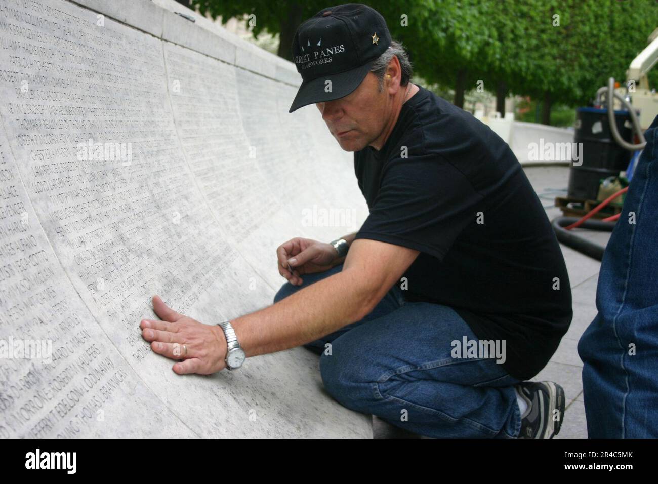 US Navy Great Panes Glassworks, checks his work after adding NCIS ...