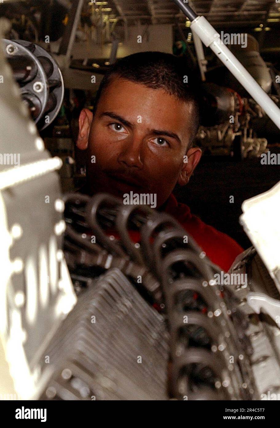 US Navy Aviation Ordnanceman 1st Class makes his final checks before ...