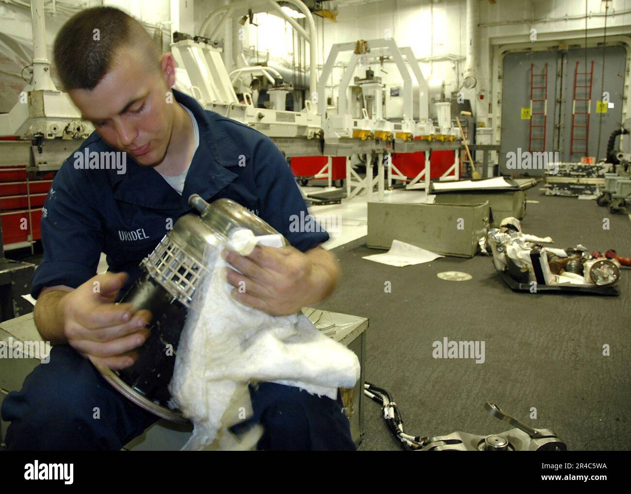US Navy U.S. Navy Aviation Machinist's Mate Airman performs ...