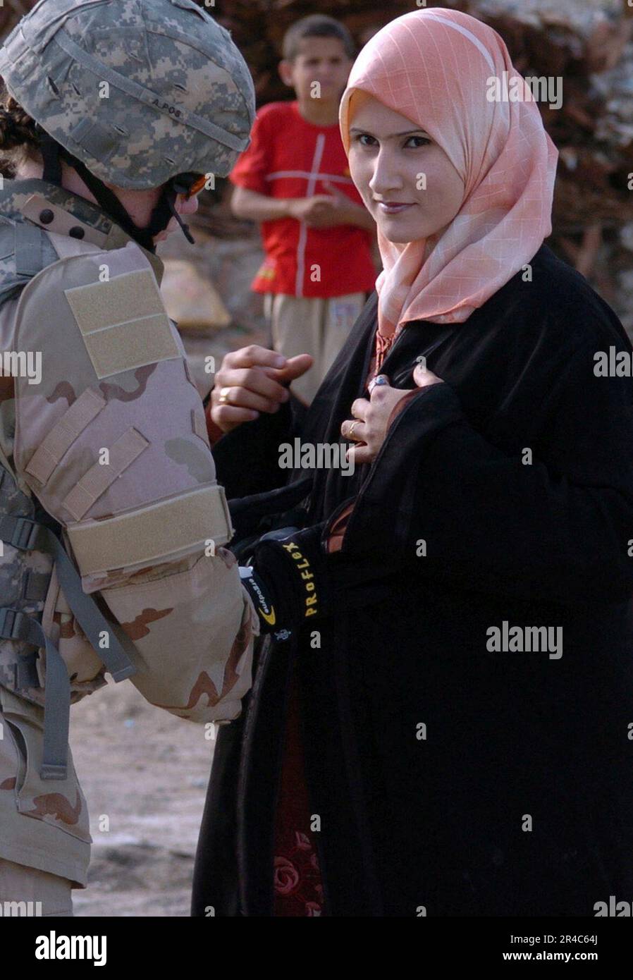 US Navy A female U.S. Army Soldier searches an Iraqi woman during a ...