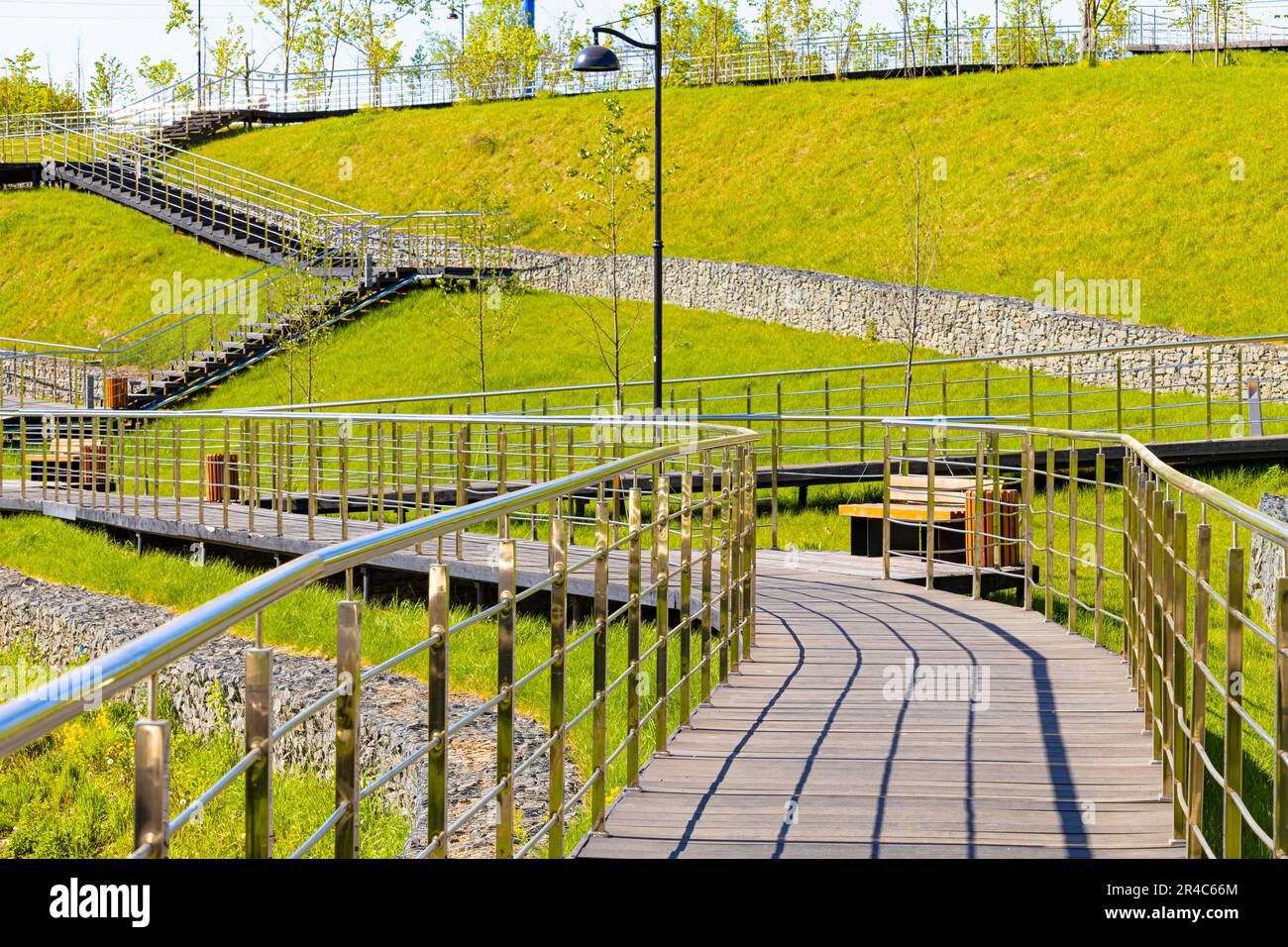 walkway with railings in a deserted park. deserted city park Stock ...