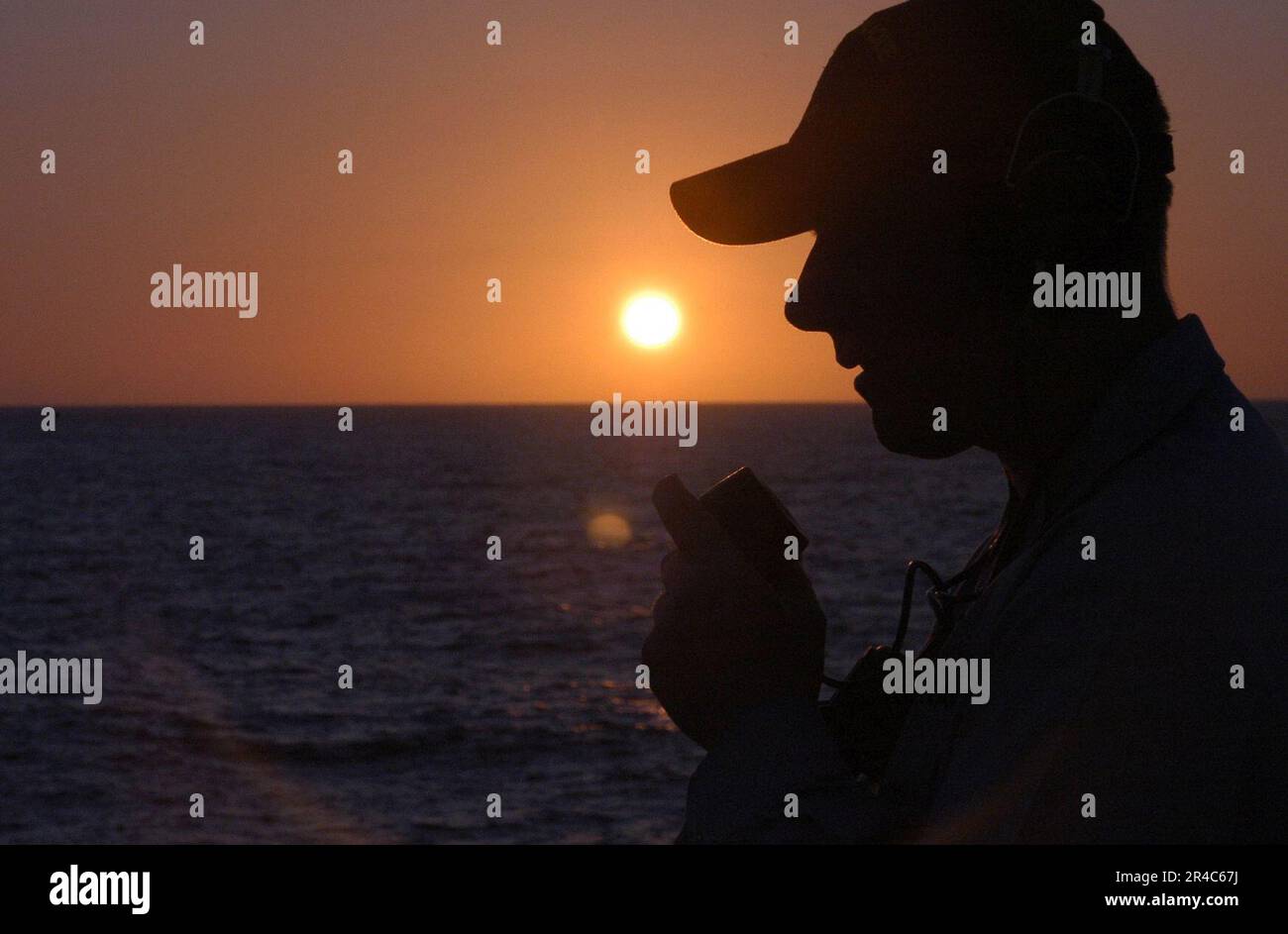 US Navy Seaman Apprentice relays information on a sound-powered ...