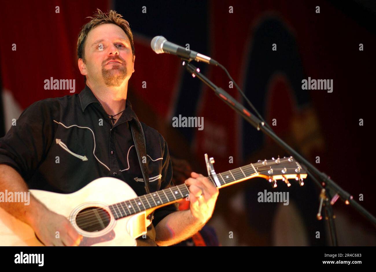 US Navy Country Music singer Chris Gray performs for the crew of USS ...