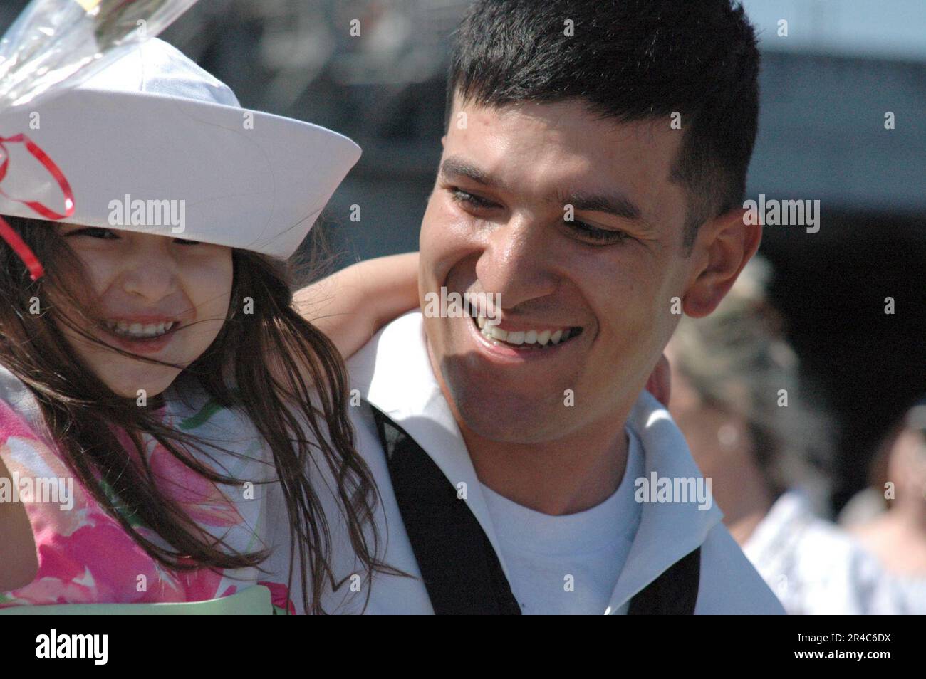 US Navy A Sailor embraces his daughter during the homecoming ...