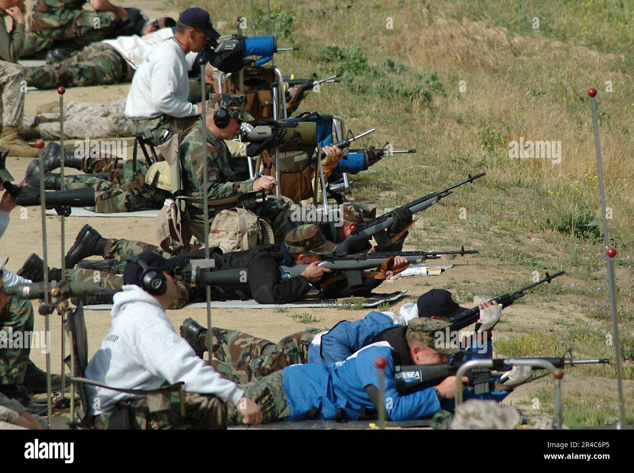 US Navy Shooters participate in the prone 500-yard prone team stage of ...