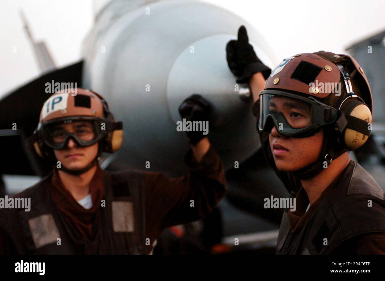 US Navy A plane captain assigned to Strike Fighter Squadron Two Two ...