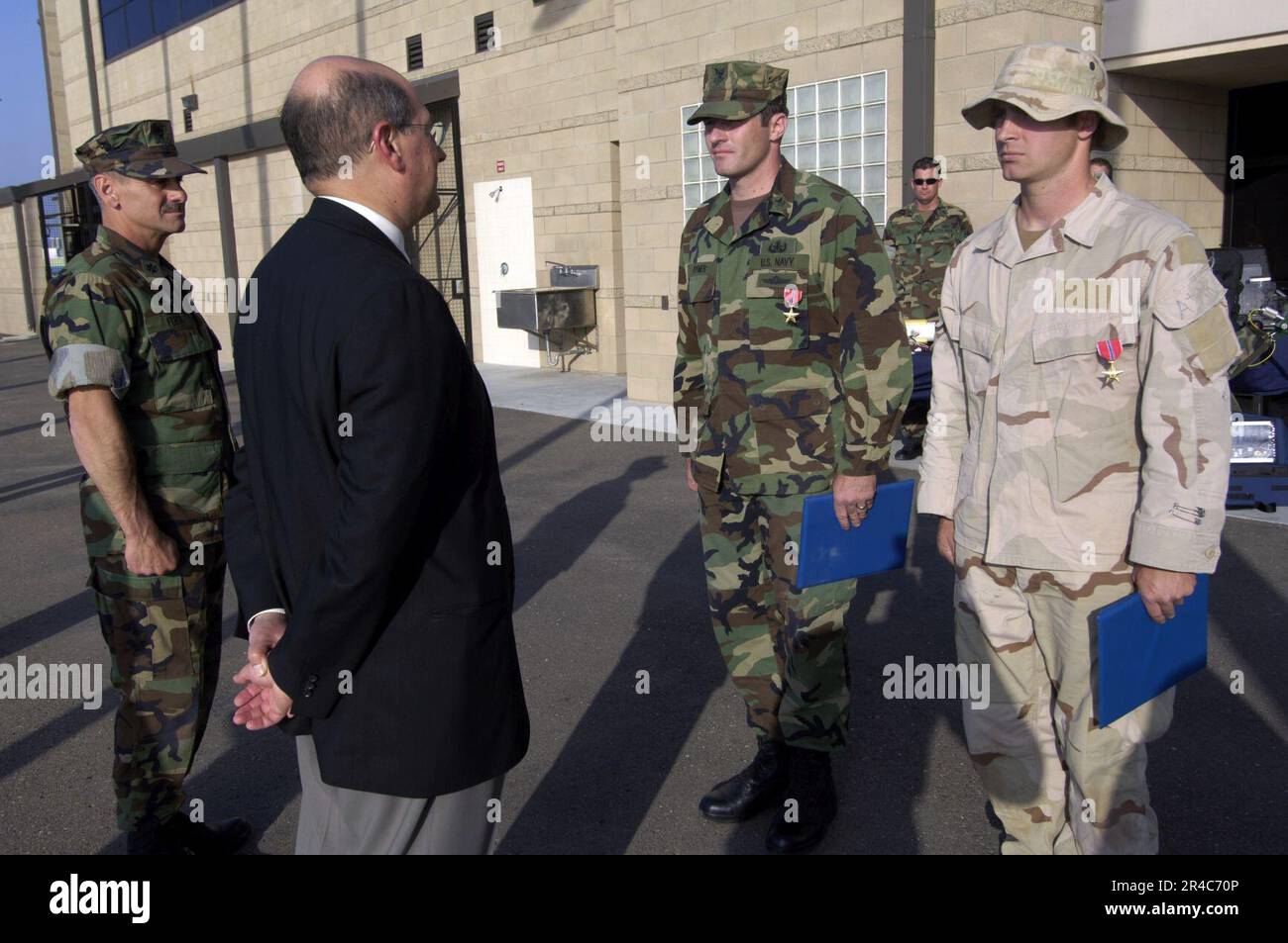 US Navy SECNAV presents the Bronze Star medal to AO1 ET1 for their ...