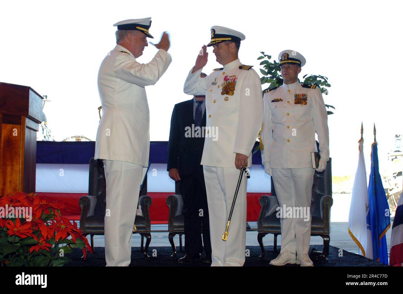 US Navy Capt. salutes Rear Adm. Garry E. Hall after being presented the ...