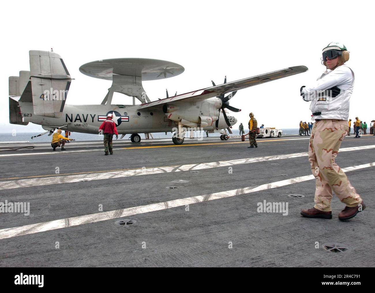 US Navy Flight deck Sailors move an E-2C Hawkeye on the flight deck ...