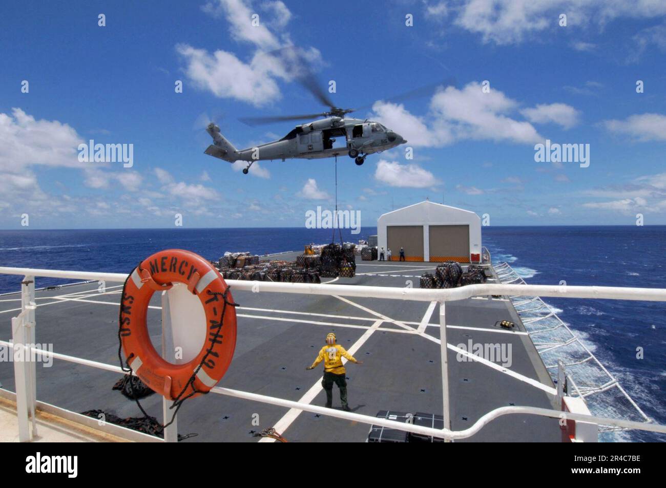 US Navy An MH-60S Seahawk prepares to land on the flight deck of USNS ...