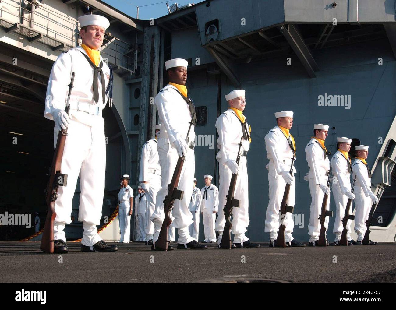 US Navy Honor Guard stands at parade rest aboard the Nimitz-class ...