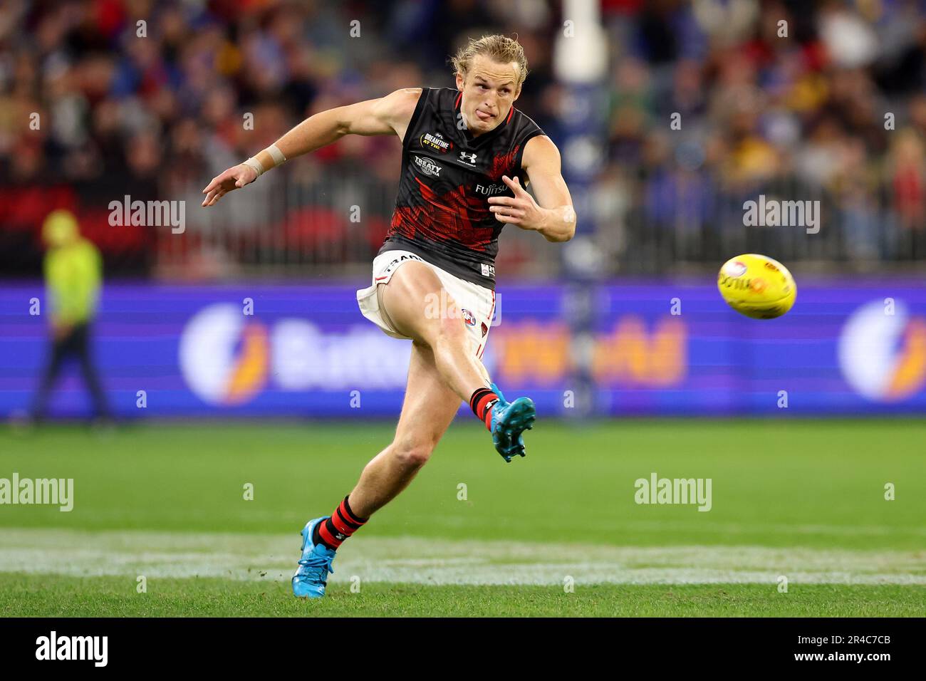 Mason Redman of the Bombers kicks the ball into the forward 50 during ...