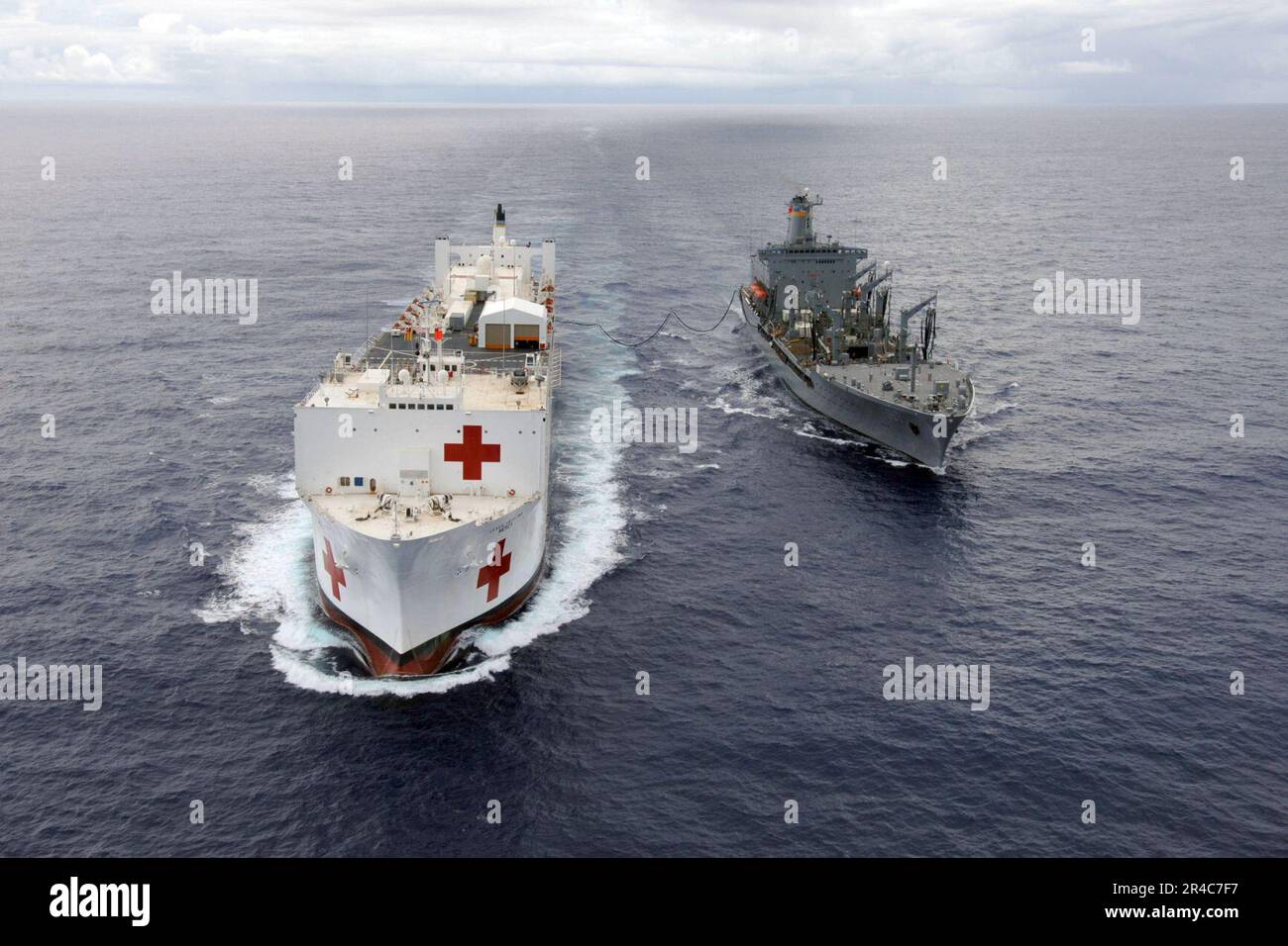 US Navy USNS Mercy performs an underway replenishment operation with ...