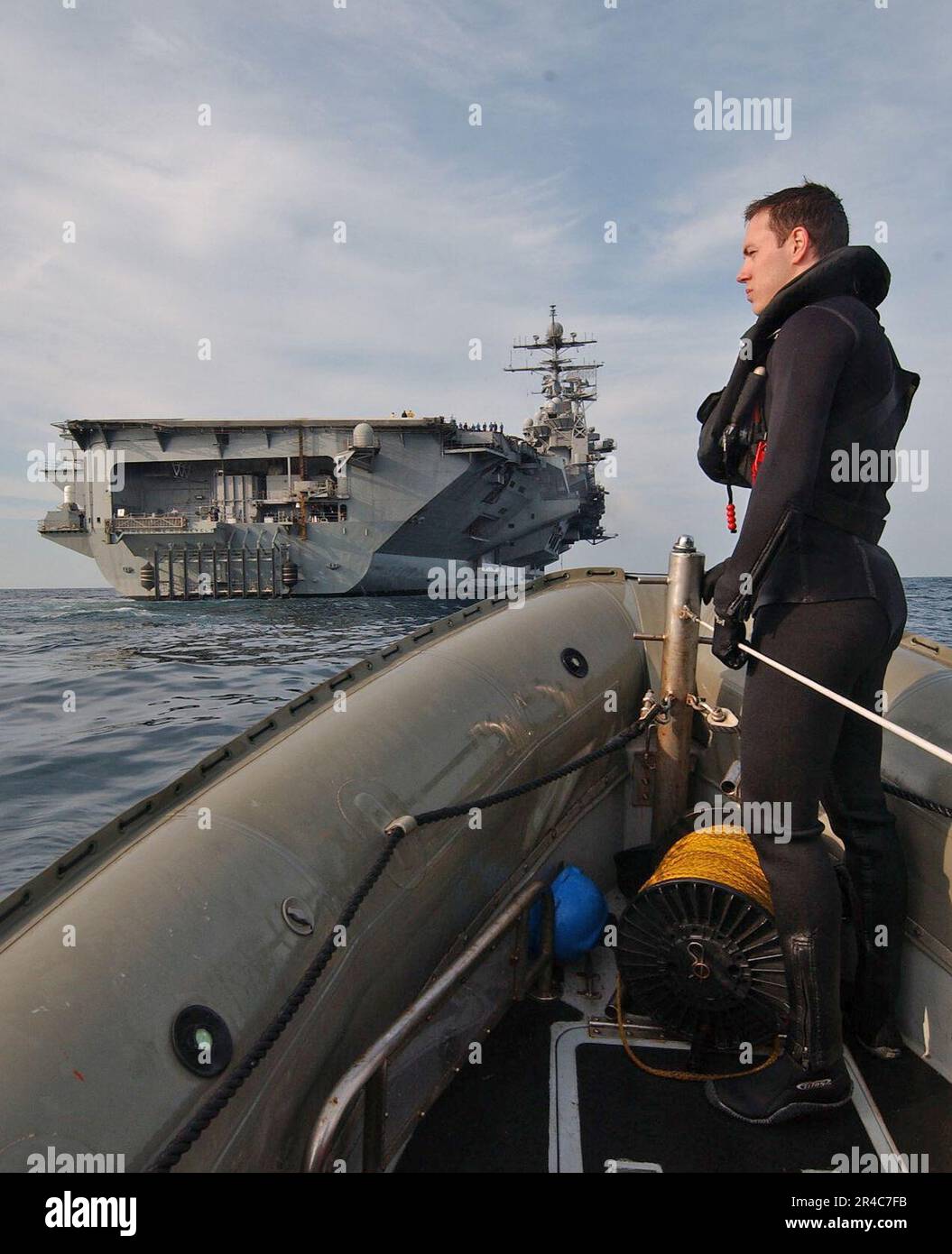 US Navy Boatswain's Mate 2nd Class a search and rescue (SAR) swimmer ...