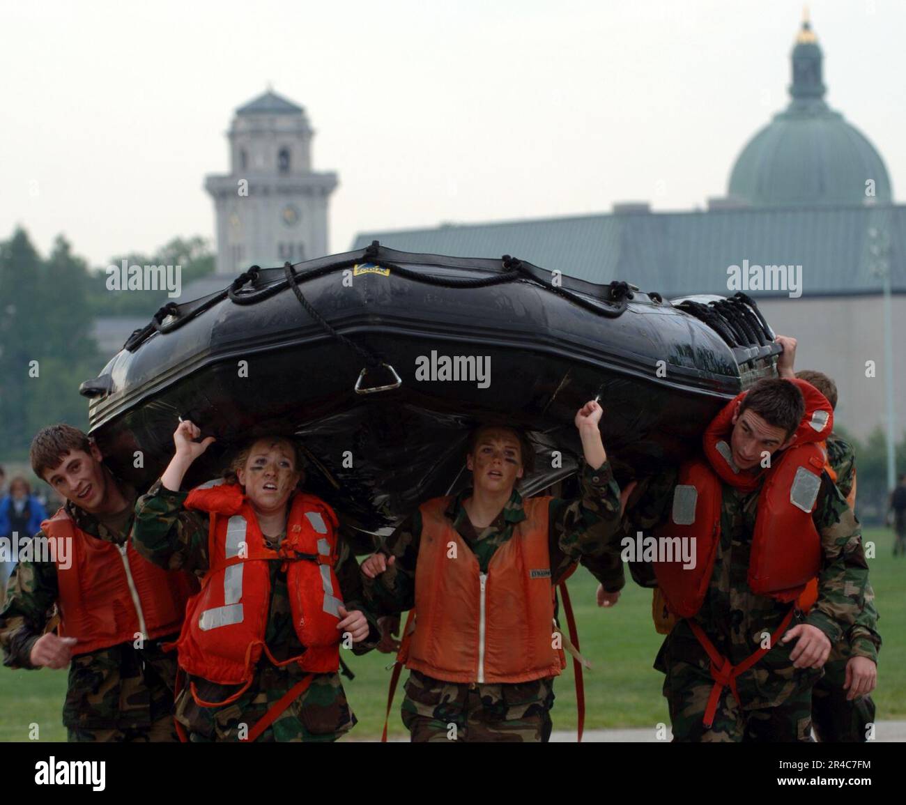 US Navy U.S. Naval Academy midshipmen carry their rubber craft during ...