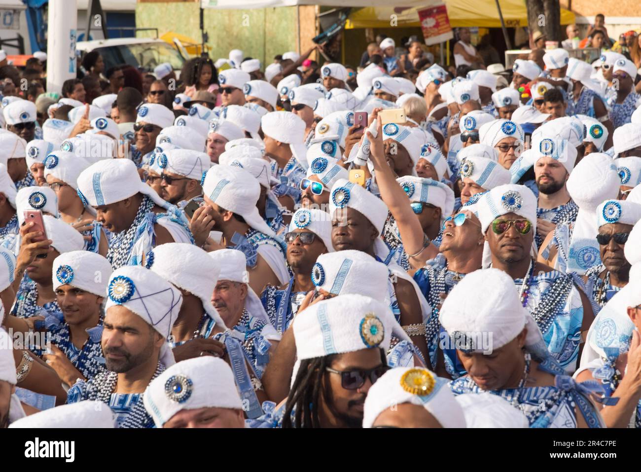 A group of people marching in a parade at the Filhos de Gandhy festival ...