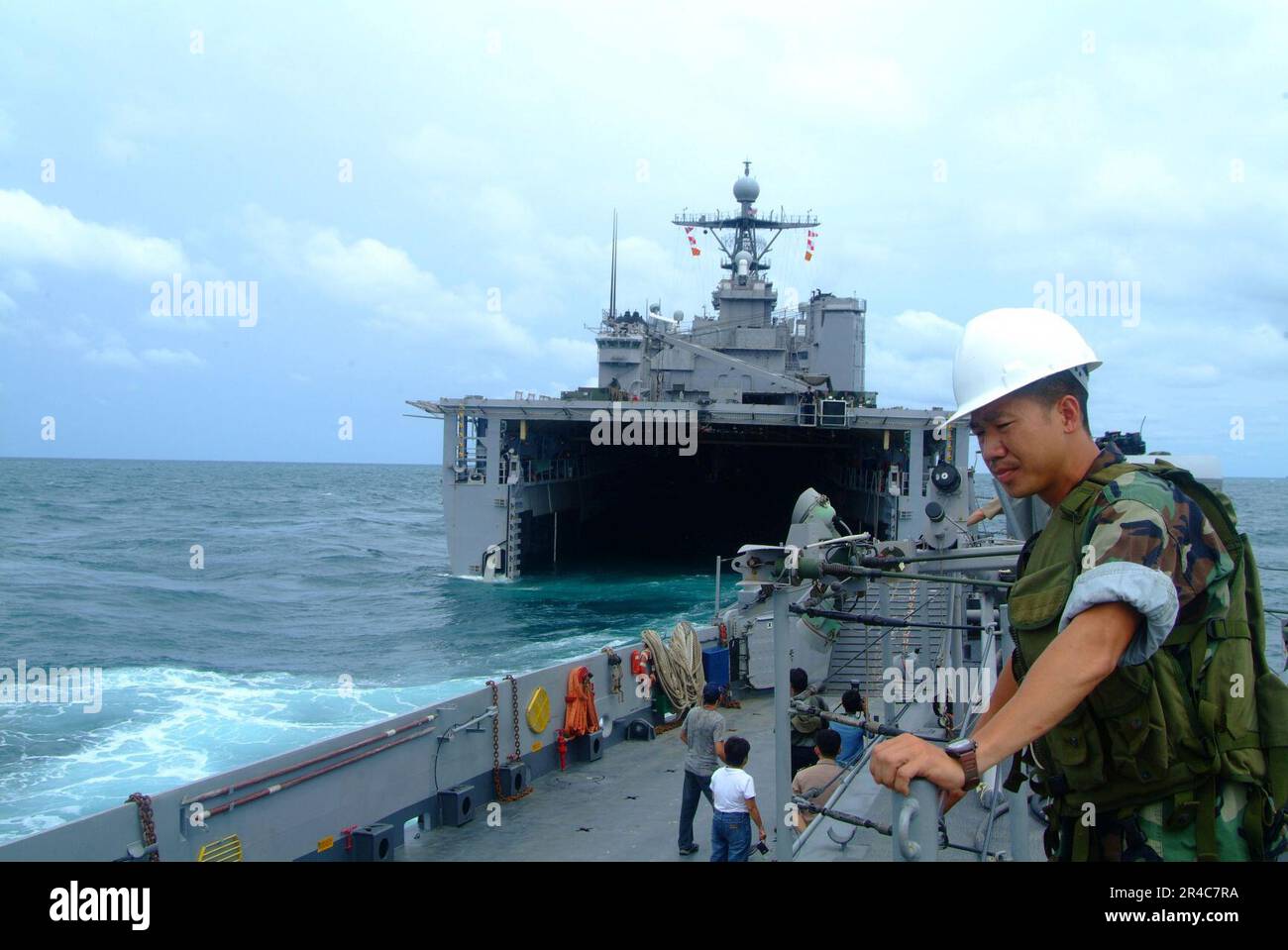US Navy Chief Engineer, Engineman 1st Class surveys the deck of Landing ...