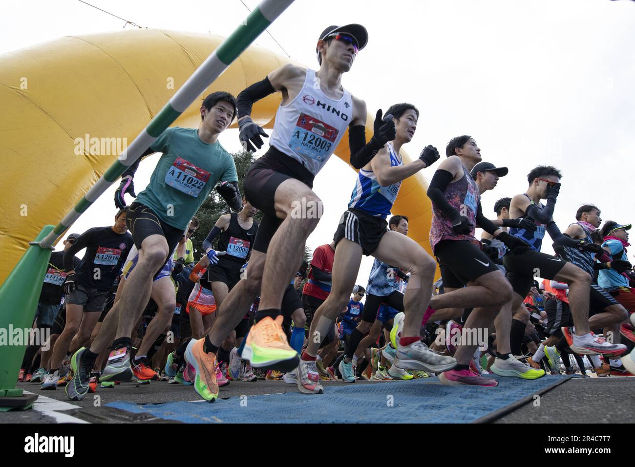 Half-marathon runners launch from the starting line during the 42nd ...