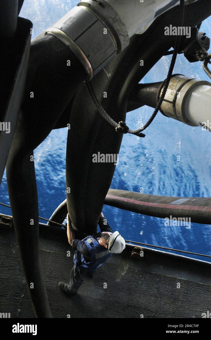 US Navy Boatswain's Mate 2nd Class ensures a close-in fuel rig is ...