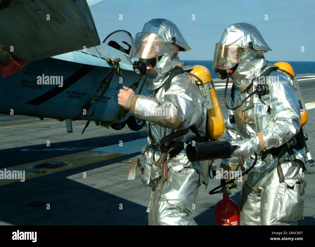 US Navy Sailors practice firefighting procedures during a mass casualty ...