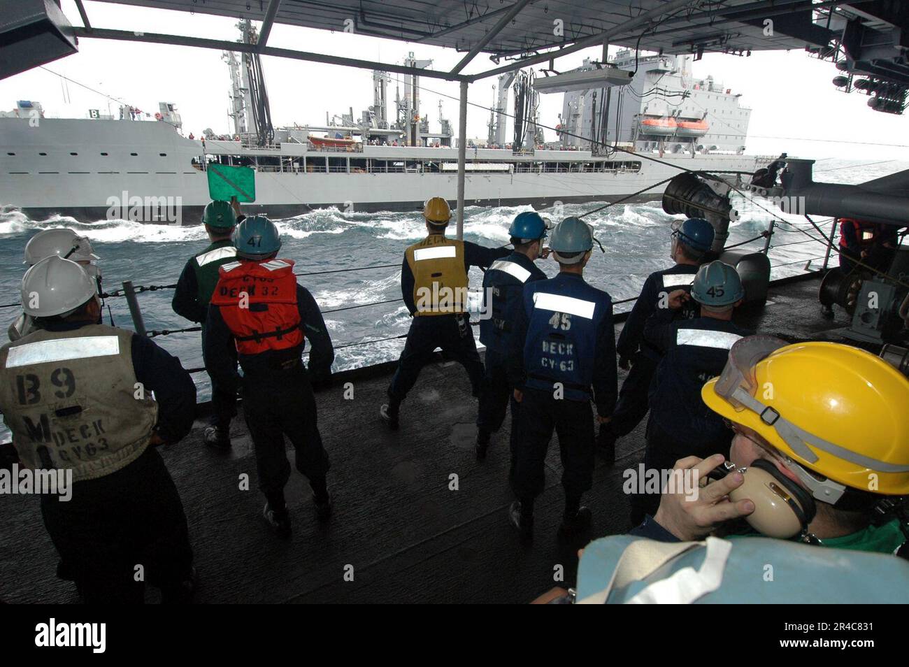 US Navy Sailors assigned to the USS Kitty Hawk (CV 63) participate in a ...
