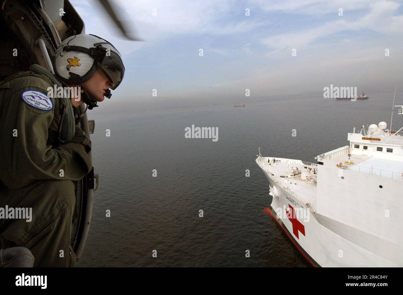 US Navy Aviation Warfare Systems Operator 2nd Class, observes the ...