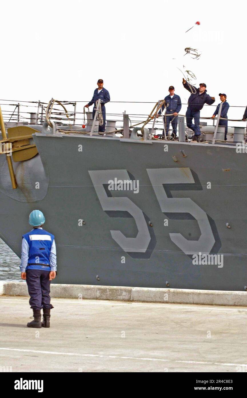 US Navy A crew member aboard the guided missile destroyer USS Stout ...