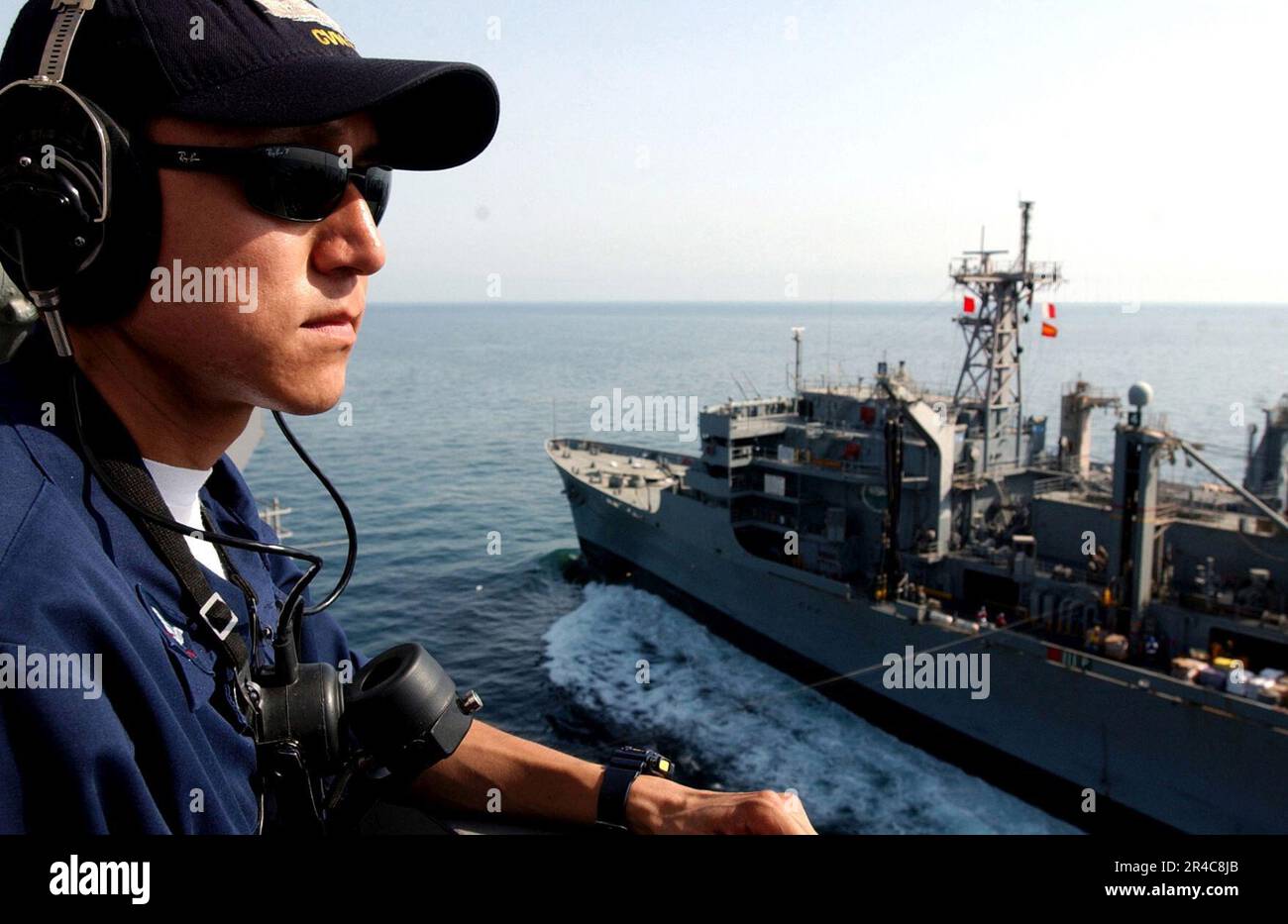 US Navy Operations Specialist 3rd Class stands a lookout watch during a ...