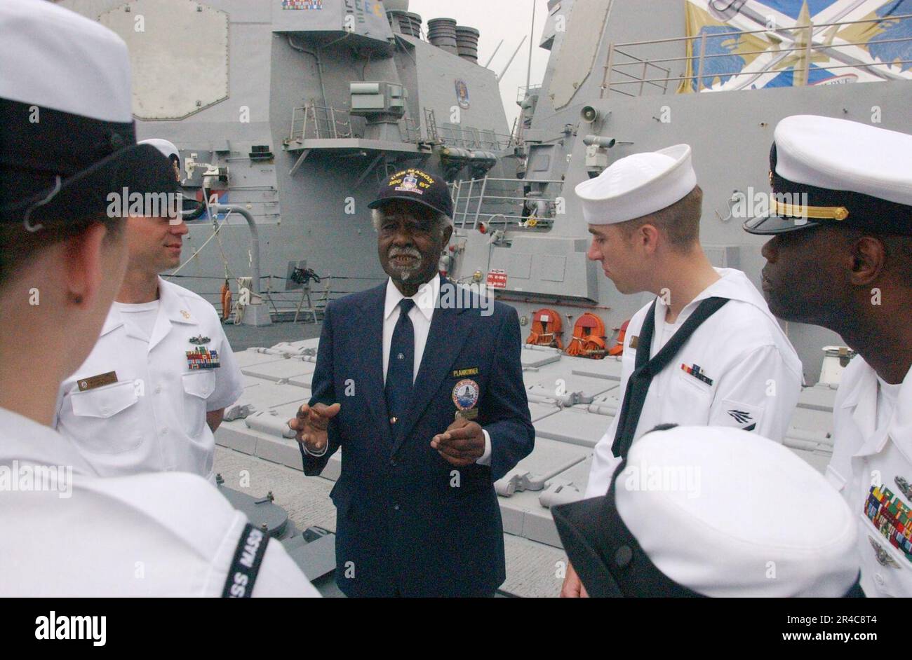 US Navy part of the crew of the first USS Mason (DE-59), talks to ...