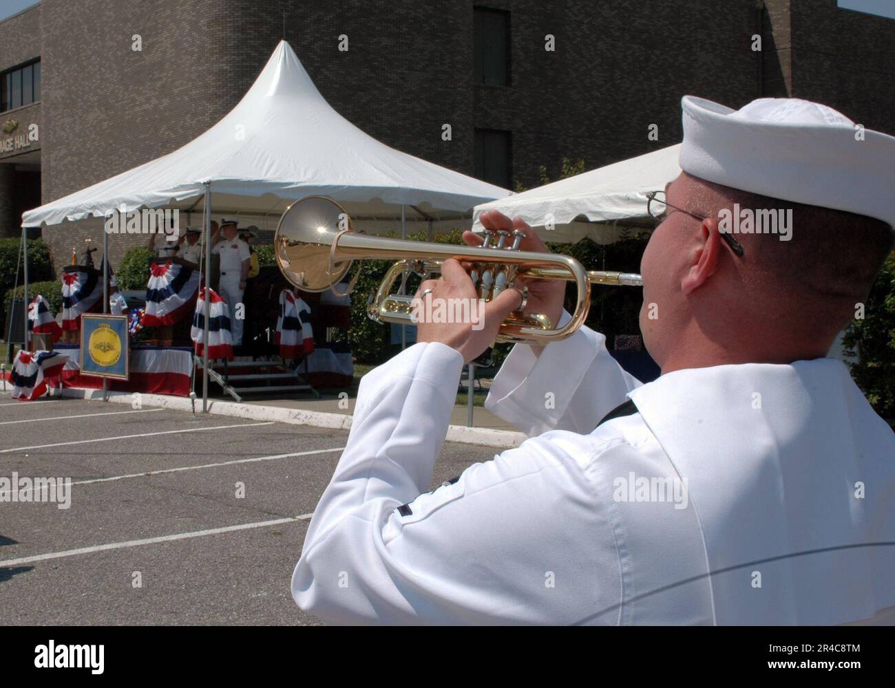 US Navy A bugler plays taps after the Memorial Service honoring the 54 ...