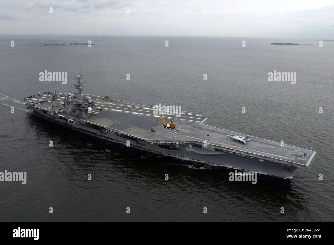 US Navy USS Kitty Hawk (CV 63) departs Yokosuka, Japan, to conduct sea ...