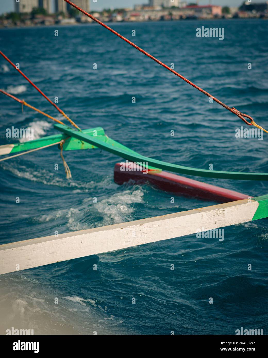 The waves hitting the side of a boat sailing on the water Stock Photo ...